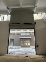 China Thermal Insulated Reinforced Industrial Sectional Overhead Door with 40mm Panel for Factory Main Gates for sale
