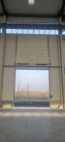China Integrated Pedestrian Door Industrial Sectional Overhead Door with 24dB Sound Insulation and Level 7-8 Wind Resistance for sale
