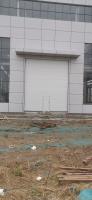 China Integrated Pedestrian Door Industrial Sectional Overhead Door with 24dB Sound Insulation and Level 7-8 Wind Resistance for sale