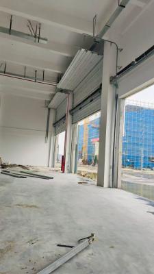 China Custom-Size Configurable Industrial Sectional Overhead Door for Non-Standard Workshop Openings with 24dB Sound Insulation for sale