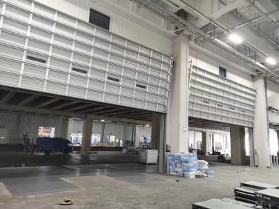 China Flexible Lift Configuration Industrial Sectional Overhead Door for High-Ceiling Warehouses with Wind Resistance Level 7-8 for sale