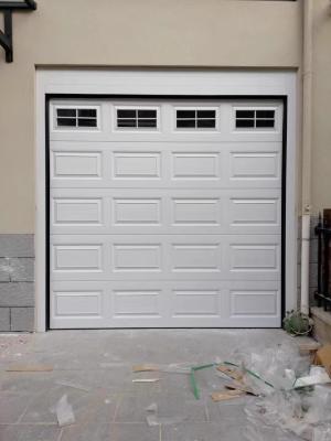 China Insulated Sectional Garage Door with 40 mm Polyurethane Foam and Protective Foam Separators in Export Wooden Crate Packaging for sale
