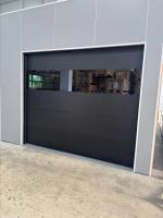 China Insulated Sectional Garage Door with 40 mm Polyurethane Foam and Protective Foam Separators in Export Wooden Crate Packaging for sale