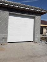 China Insulated Sectional Garage Door with Weight-Matched Torsion Spring and 40 mm Polyurethane Insulated Panels for Residential Use for sale