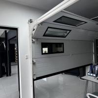 China Insulated Sectional Garage Door with Optional Finger Protection Panel Design and 40 mm Polyurethane Insulated Panels for sale