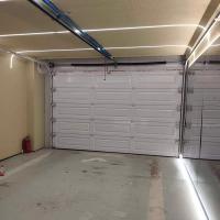 China Insulated Sectional Garage Door with Optional Finger Protection Panel Design and 40 mm Polyurethane Insulated Panels for sale