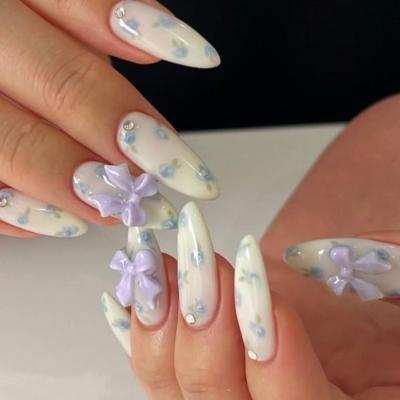 China FDA 3D Press On Nails Blue Flower Purple Bow Reusable White Almond Nails for sale