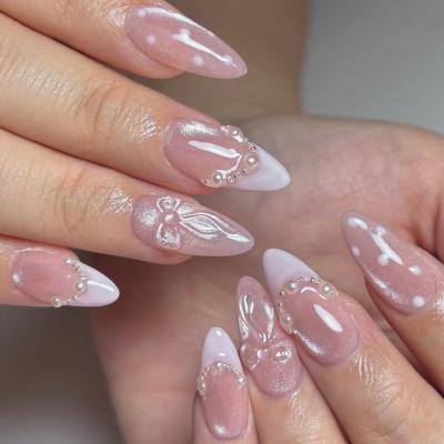 China Almond Cat Eye Fake Nails 3D Bow Pearl Chain Glitter Bright Pink Fake Nails for sale