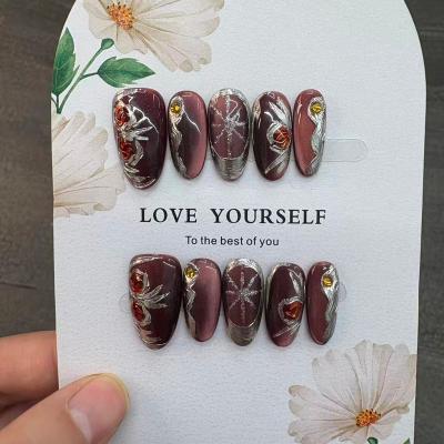 China Cat Eye Design Handmade False Nails Flower Design Almond Shape for sale