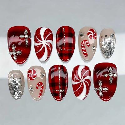 China Wholesale Plaid Candy Cane Christmas Holiday Press On Nails Almond Red Rhinestone for sale