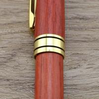 China Red Sandalwood Luxury Roller Ball Pen 0.5mm Business Roller Pen With Gold Accessories for sale