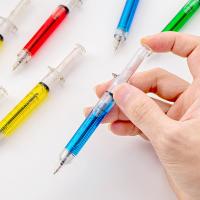 China Creative Syringe Style Ballpoint Pen Colorful Oil Filling Plastic Ball Pen for sale