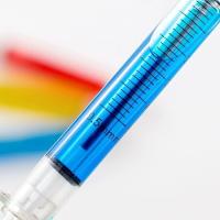 China Creative Syringe Style Ballpoint Pen Colorful Oil Filling Plastic Ball Pen for sale