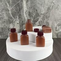 China 10ml HDPE Plastic Bottle with PP Screw Cap and 30ml Measuring Cup for Hair Dye for sale