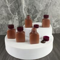 China 10ml HDPE Plastic Bottle with PP Screw Cap and 30ml Measuring Cup for Hair Dye for sale