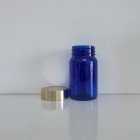 China 70ml Cobalt Blue PET Capsule Bottle with Gold Plated Aluminum Lid for Pill Supplement Packaging for sale