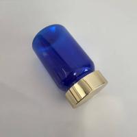 China 70ml Cobalt Blue PET Capsule Bottle with Gold Plated Aluminum Lid for Pill Supplement Packaging for sale