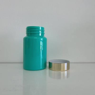 China 90ml Green PET Plastic Bottle with Gold Plated Aluminum Screw Cap for Pill Candy Packaging for sale