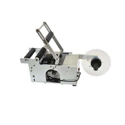 China Hand Pressed Round Bottle Labeling Machine Semi Automatic 220V for sale