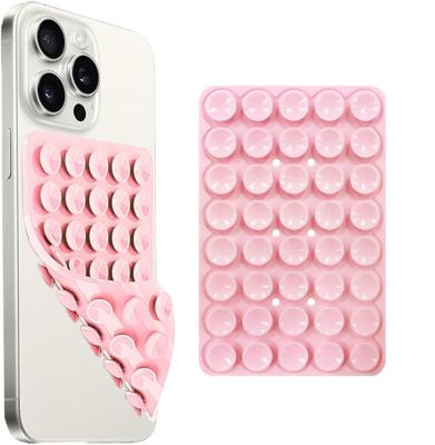 China Portable 24 Sucker Double Sided Acrylic Adhesive Silicone Phone Holder 0.6mm Low Noise Removable Selfie Case for sale