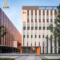 China Multi Story Prefab Steel Structure Building with 10-Year Warranty High-Strength Steel and Thermal Acoustic Insulation for sale