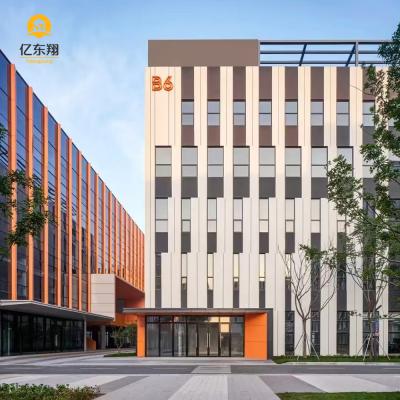 China Multi Story Prefab Steel Structure Building with 10-Year Warranty High-Strength Steel and Thermal Acoustic Insulation for sale