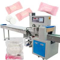 China Fully Automatic Disposable Hotel Supplies Pillow Packaging Machine for Disposable Compressed Towels and Bath Towels Packing for sale