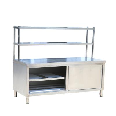 China Stainless Steel Work Table with Sliding Door Design and Adjustable Height Legs for Commercial Kitchen for sale