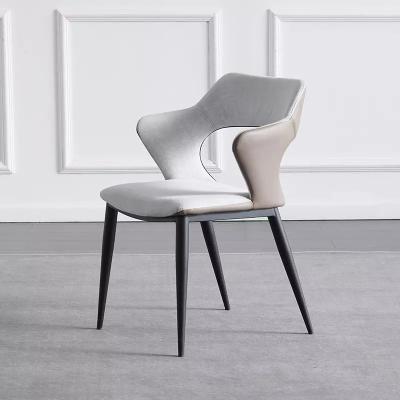 China Steel Frame Nordic Leather Chair Armrest Dining Chair Hollow Outdesign for sale
