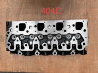 China 111017930 Perkins Cylinder Head Model 404c Material Casting Cylinder Head for sale