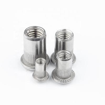 China Custom Size Stainless Steel Railcar Rivet Nut Flat Head Knurled Body Zinc Plated for sale