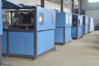 China 4000-4500 pcs Theoretical Output Four Cavity Spring Water Bottle Blow Molding Machine for sale
