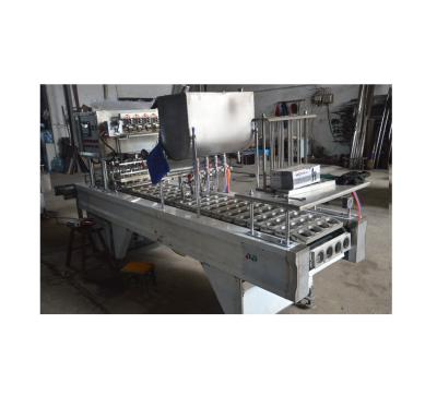 China Convenient Pneumatic Flavored Yoghurt Cup Filling And Sealing Machine for Plastic Cups for sale