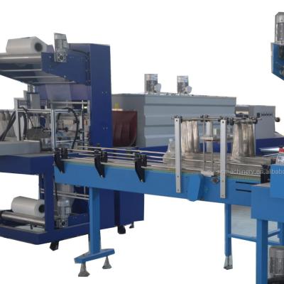 China 1200 KG Full Automatic Water Bottles Group Packaging Machine and Heat Tunnel for Fast Packaging for sale