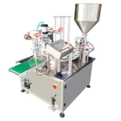 China Plastic Packaging Material 2000BPH Full Automatic Rotary Cup Juice Filling and Sealing Machine for sale