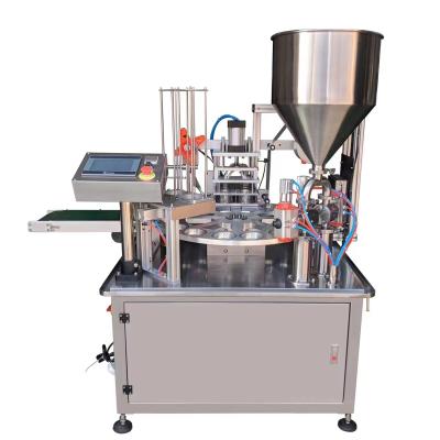 China 2 Hole Rotary Cup Juice Filling and Sealing Machine for 380 KG Capacity Packaging Line for sale