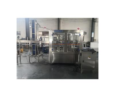 China 2000BPH 3000BPH PET Bottle Rinsing Filling Capping Machine with 100% Filling Accuracy for sale