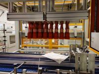 China Electric Driven Bottle Top Loading Carton Packing Machine with PLC Control Technology for sale