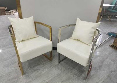 China Gold Plated Ergonomic Backrest Leather Upholstered Dining Chair With Armrests for sale