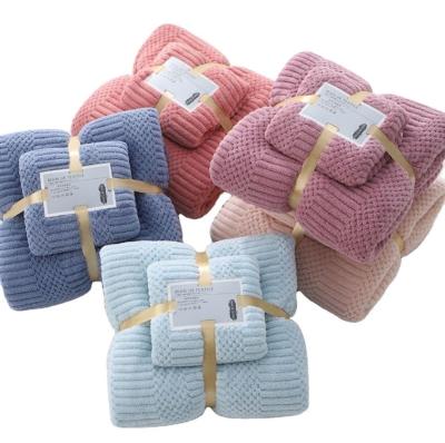China Thick and Soft Coral Fleece Bath Towel Set Perfect for All Ages Auspicious Grid Design for sale