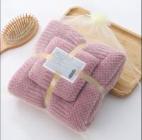 China Thick and Soft Coral Fleece Bath Towel Set Perfect for All Ages Auspicious Grid Design for sale