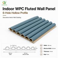 China Wood Grain 3D Embossed Wood Plastic Composite WPC Wall Panel for Restaurant Shop Wall Decoration for sale