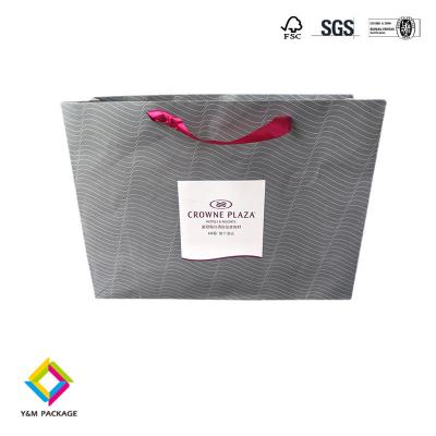 China Custom Kraft Paper Shopping Bag with Handles 150gsm ISO Certified for sale