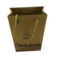 China Custom Printed Kraft Paper Bags 32x8x23cm with Nylon Handle for Apparel Packaging for sale