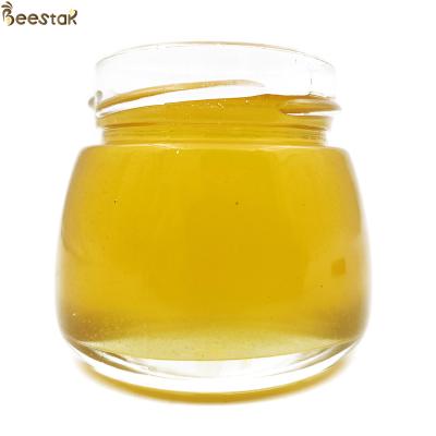 China Pure Raw Honey Nature Fruitwood Flower Honey No Addictive Bright Yellow Color 100% Ntatural Bee Honey for sale