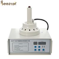 China Mini Manual Electromagnetic Induction Sealing Machine with 100-500W Adjustable Power and Copper Coil for 20-130mm Applicable Caliber for sale