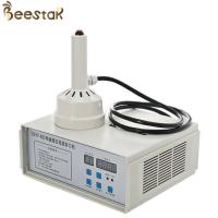China Mini Manual Electromagnetic Induction Sealing Machine with 100-500W Adjustable Power and Copper Coil for 20-130mm Applicable Caliber for sale