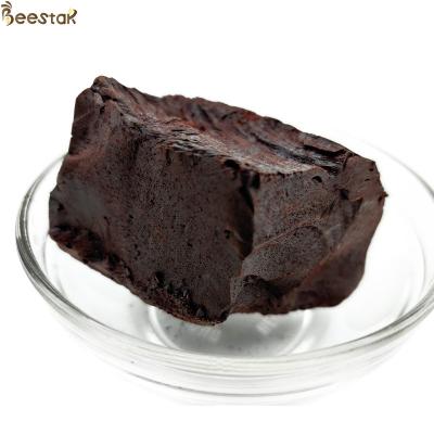 China Organic 90% Extract Bee Propolis Block for Health Care with Black Color for sale
