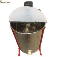China 4 Frames Stainless Steel Electric Honey Extractor With Stands And Honey Gate for sale