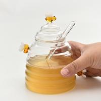 China 450ml Transparent Food Grade Glass Honey Pot with Stirring Rod and Bees Storage Jar for sale